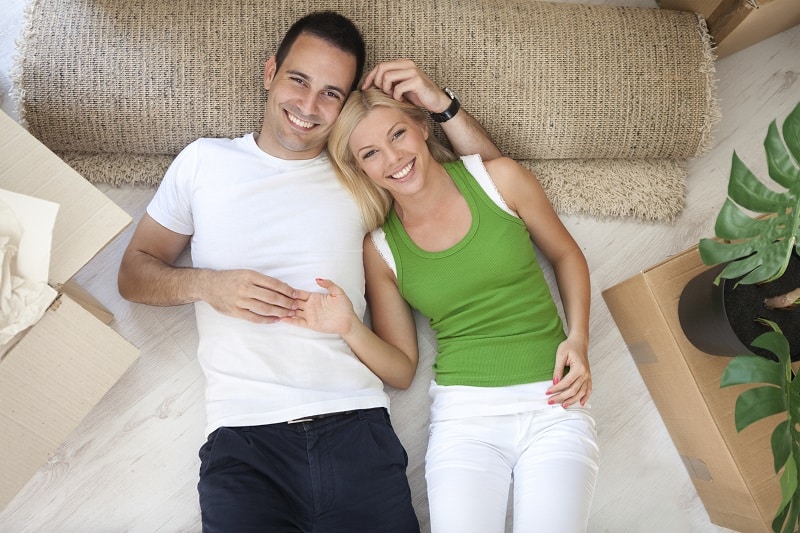 Couple Lying On Floor Of New Flat Dr Kim Blackham